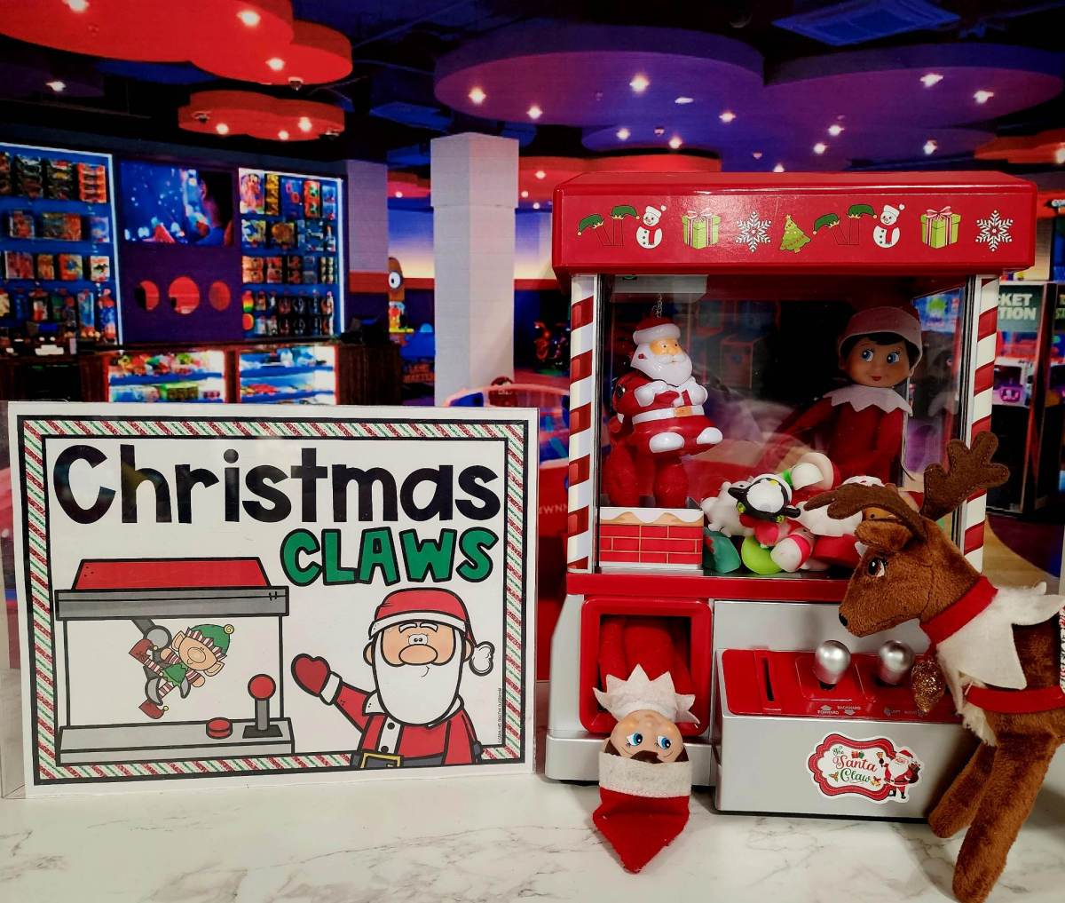Claw Machine Elf Printable Poster FREEBIE – Elf Day 14